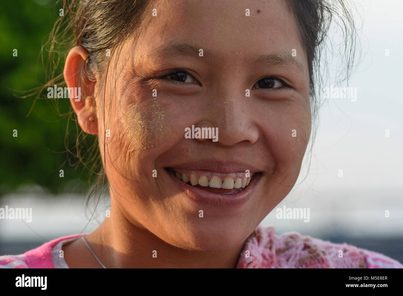 Kyaikto: woman, face with thanaka cosmetic paste, , Mon State, Myanmar ...