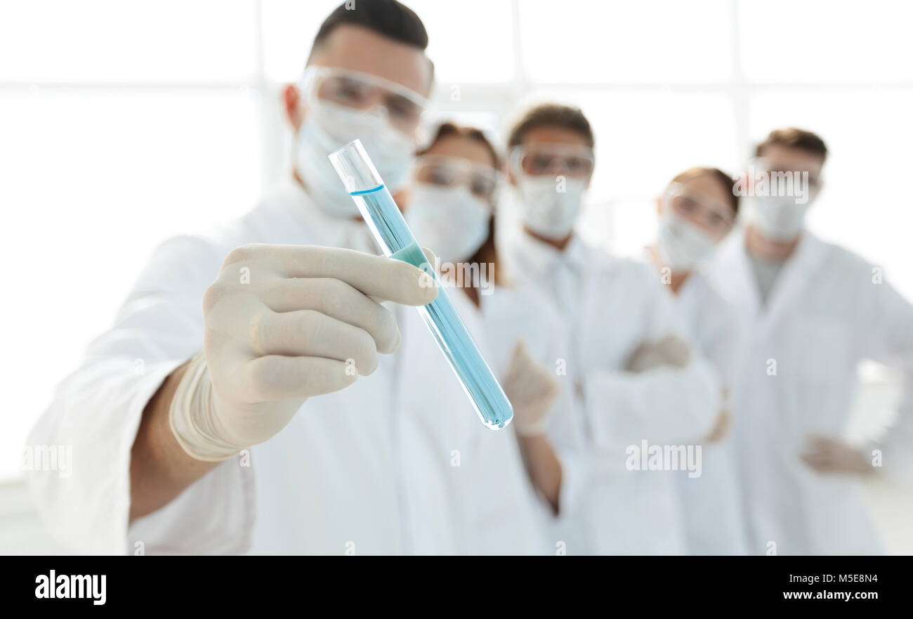 background image is a group of medical workers working with liquids in ...