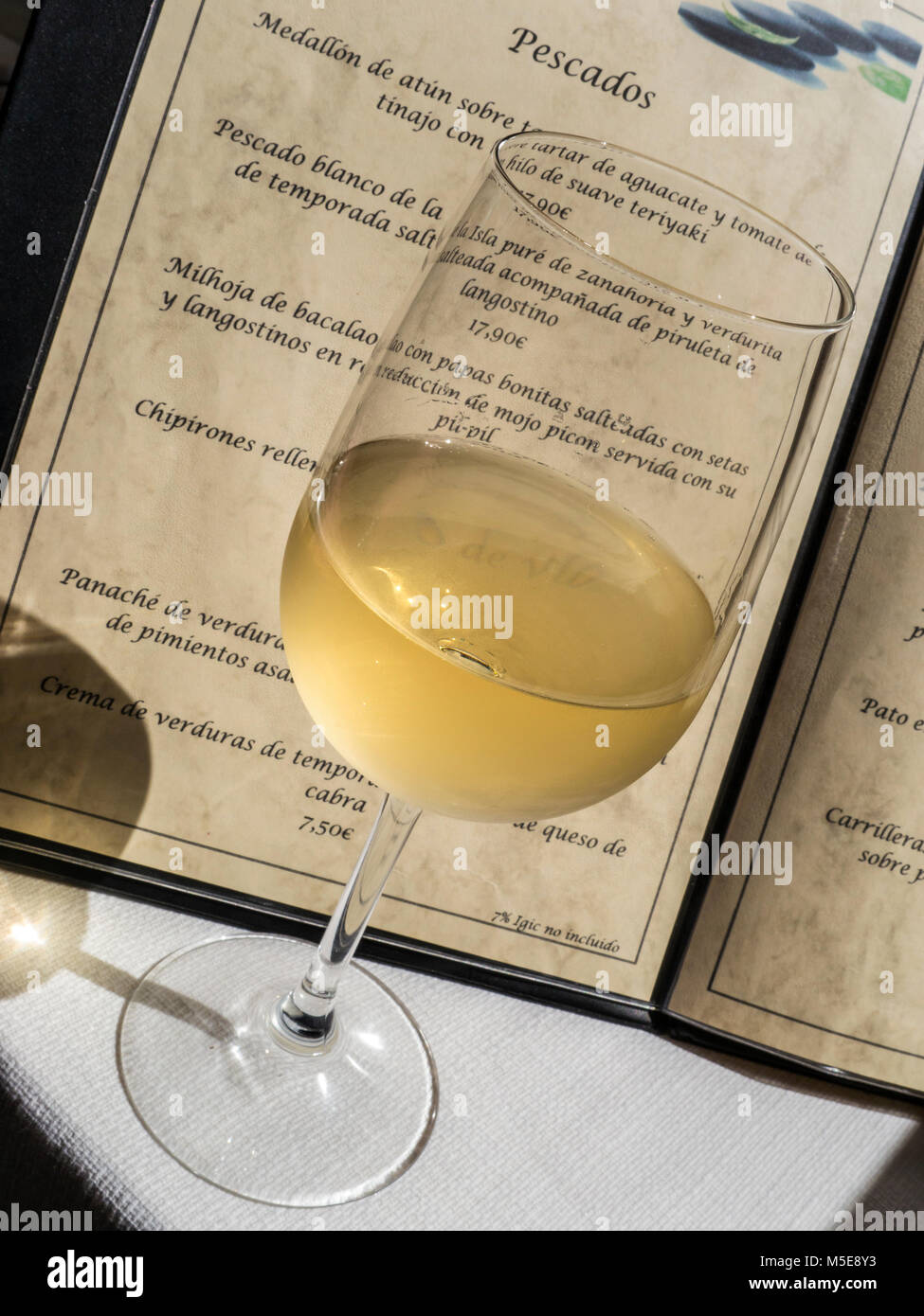 White wine glass and fish menu choices restaurant carte alfresco sun ...