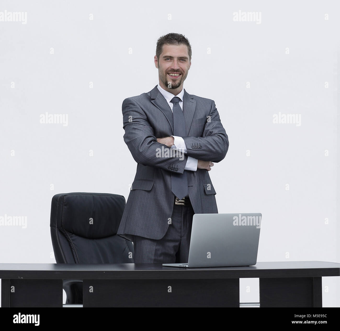 Boss sitting behind desk standing hi-res stock photography and images ...