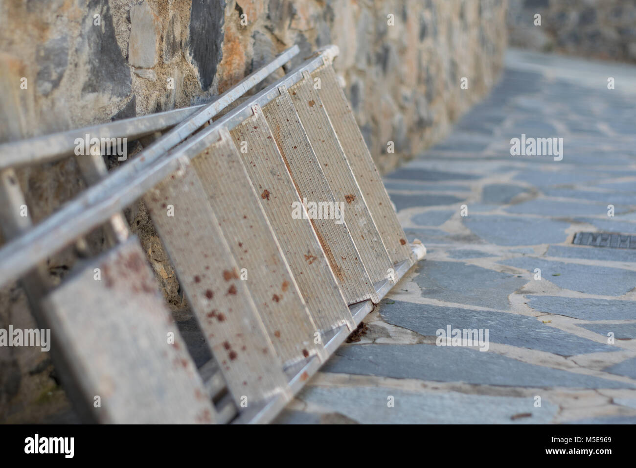 Ladder on the ground Stock Photo - Alamy