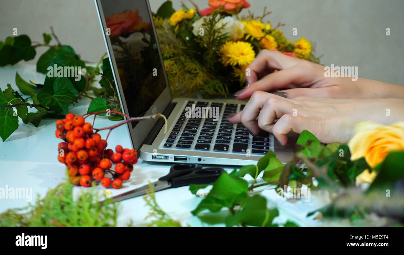 Shooting close-up of computer on which girl's hand prints floris Stock ...