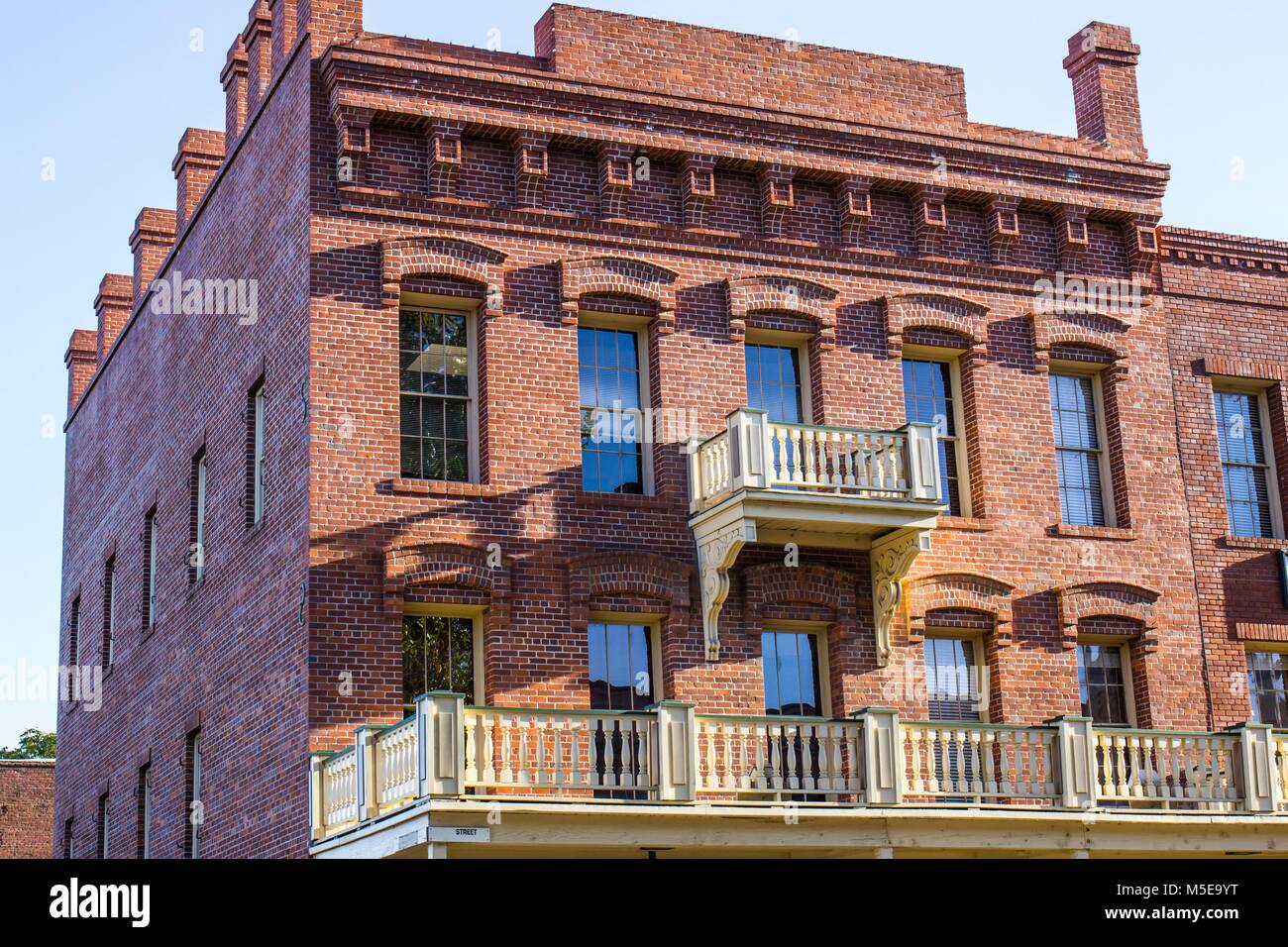 Front Of Vintage Multi Story Brick Building With Balconies Stock Photo ...