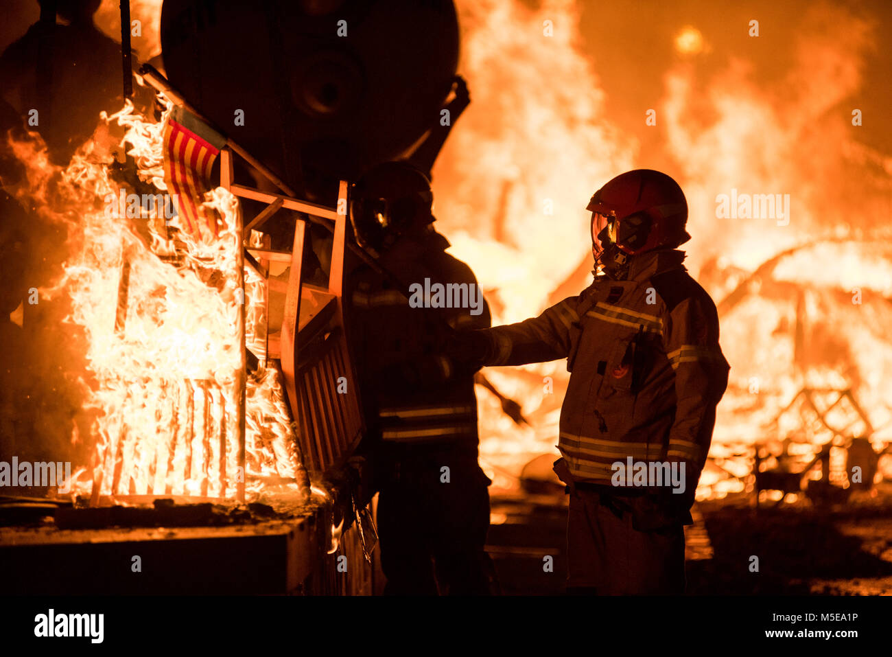 Firefighters at work during the night of "La Crema" the burning at the ...