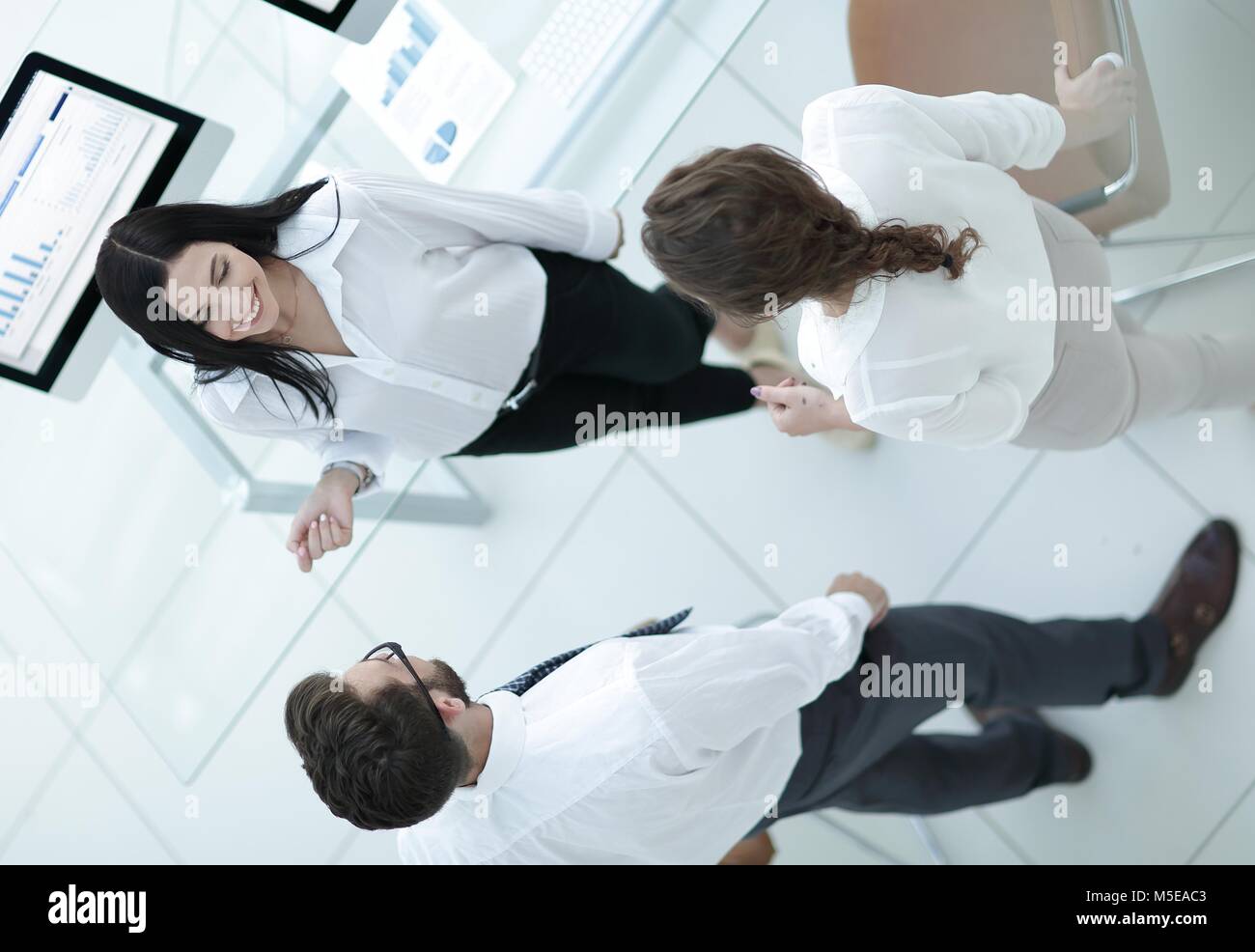 company employees are talking in the office Stock Photo - Alamy