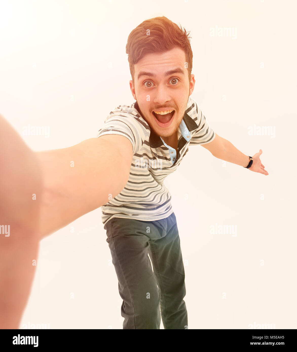 closeup.Happy modern guy showing his success Stock Photo - Alamy
