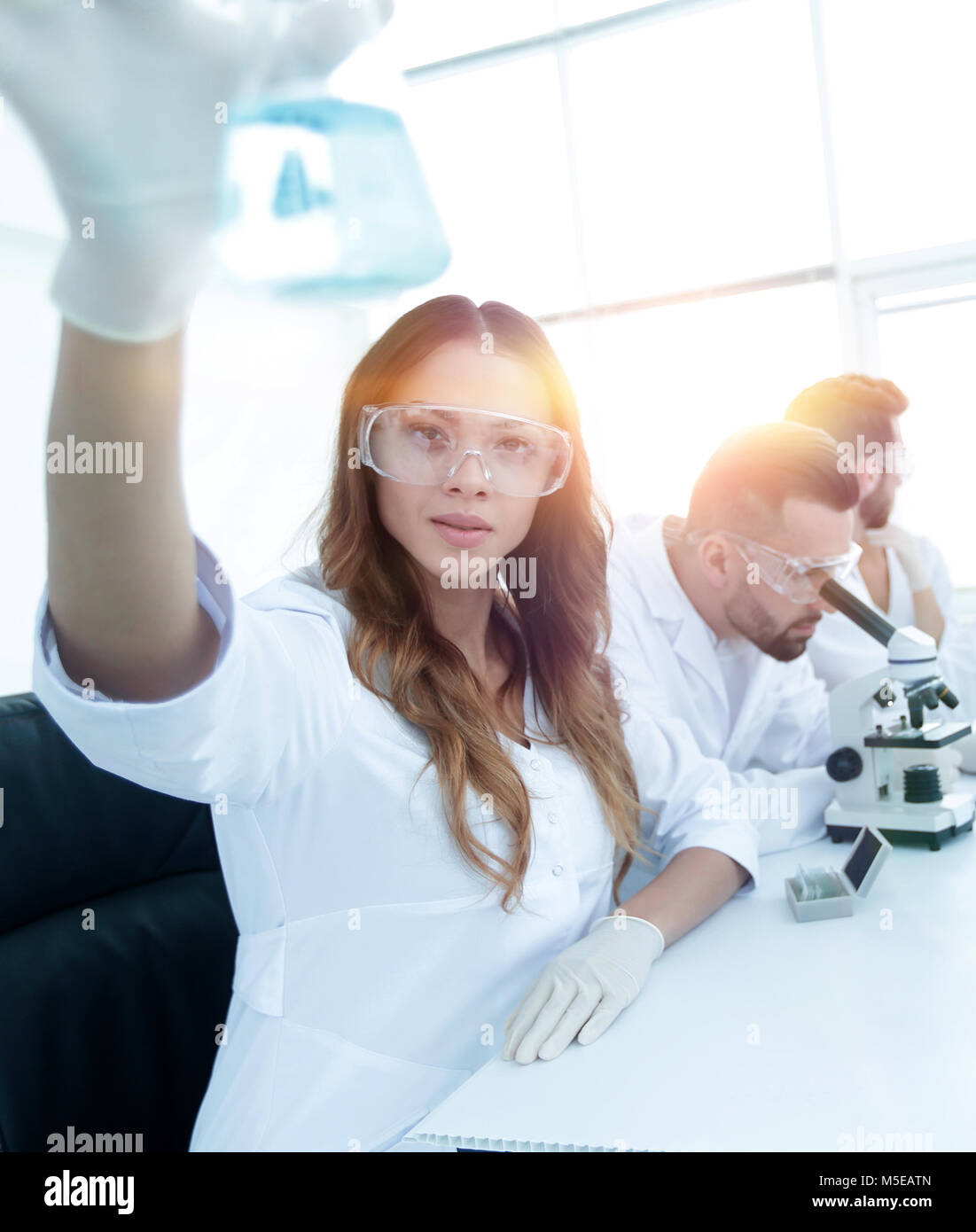 group of creative scientists working in a laboratory Stock Photo - Alamy