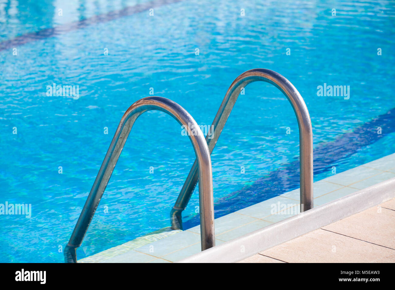 Swimming pool with blue water Stock Photo - Alamy