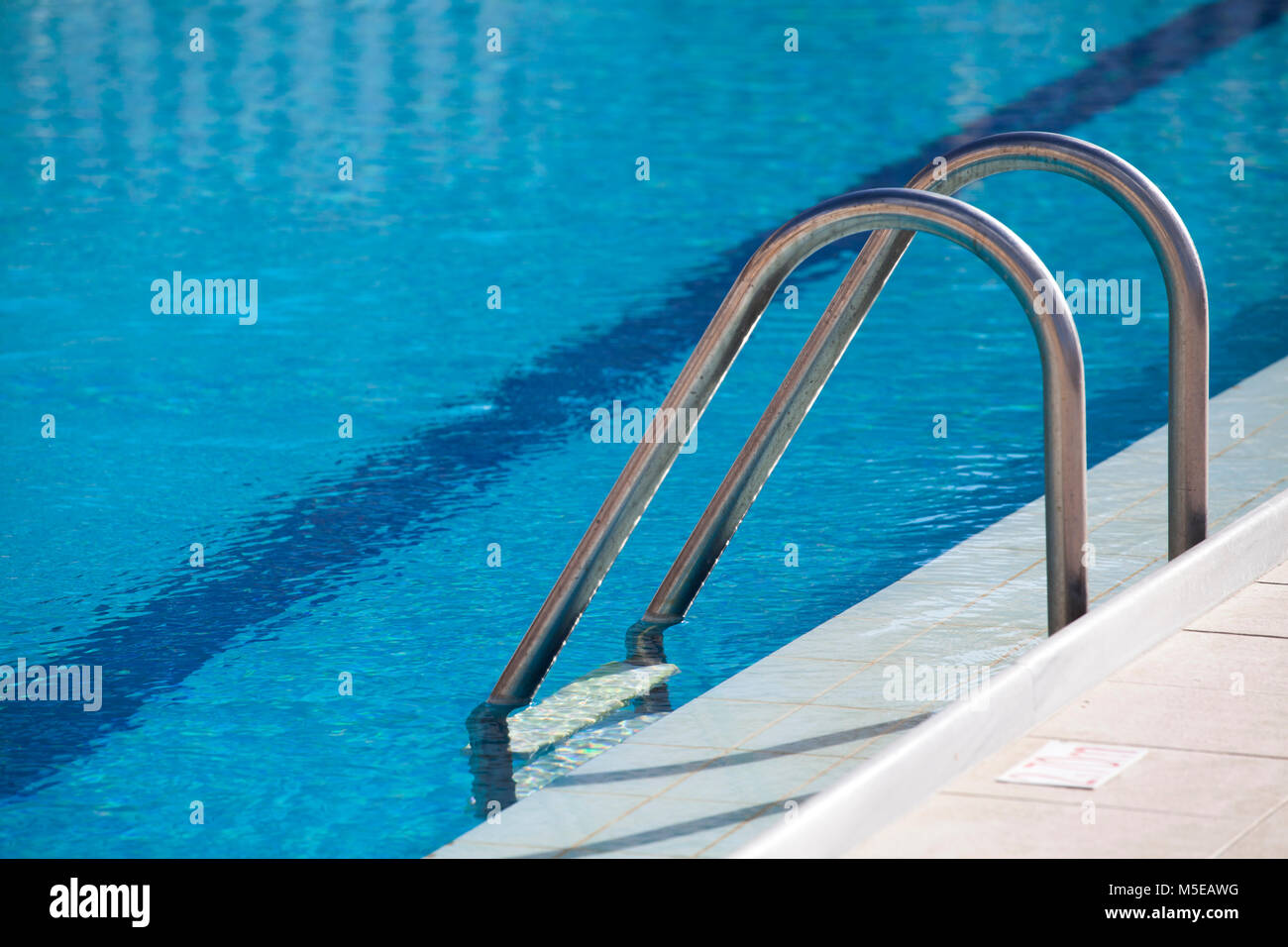 Swimming pool with blue water Stock Photo - Alamy