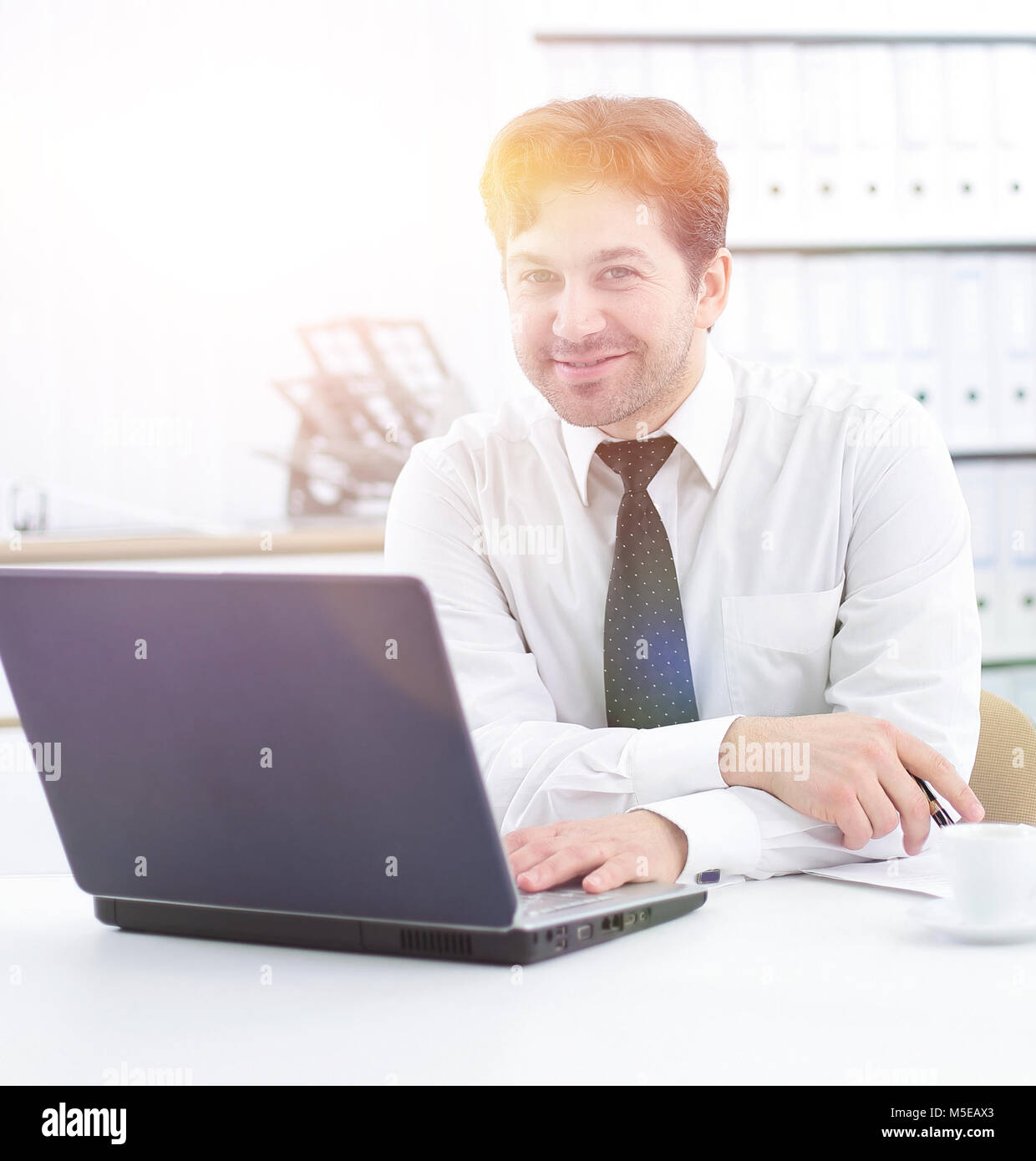 closeup of sitting behind a Desk Stock Photo - Alamy