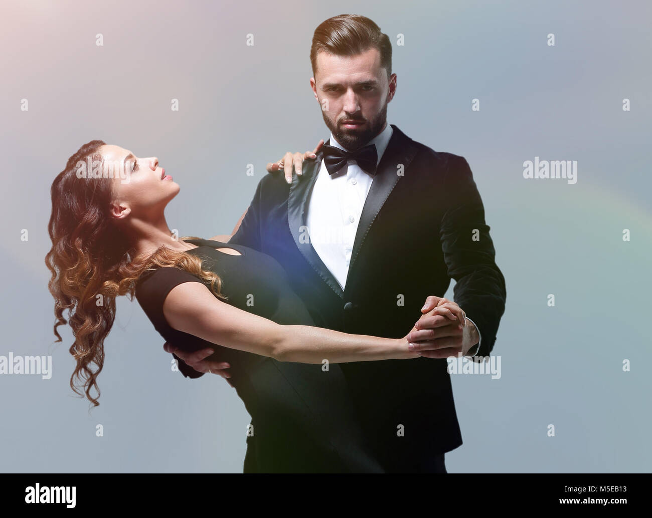 passion dancers over grey background Stock Photo - Alamy