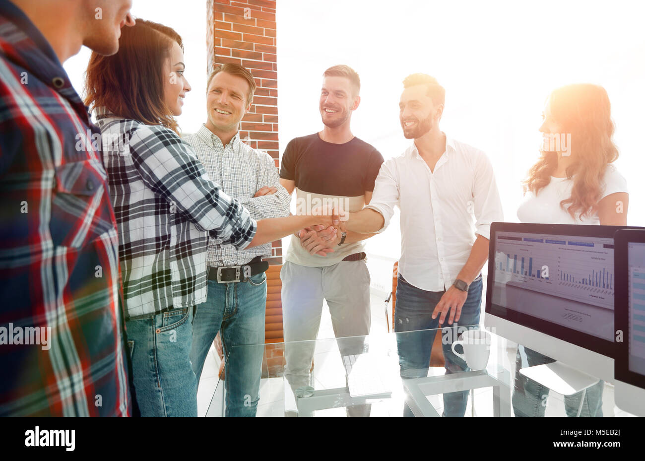 friendly handshake between Manager and employee Stock Photo - Alamy