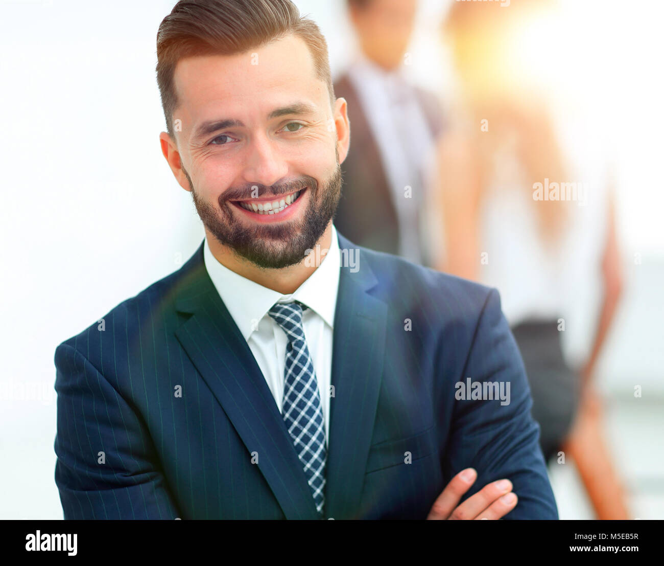 businessman on background of office Stock Photo - Alamy