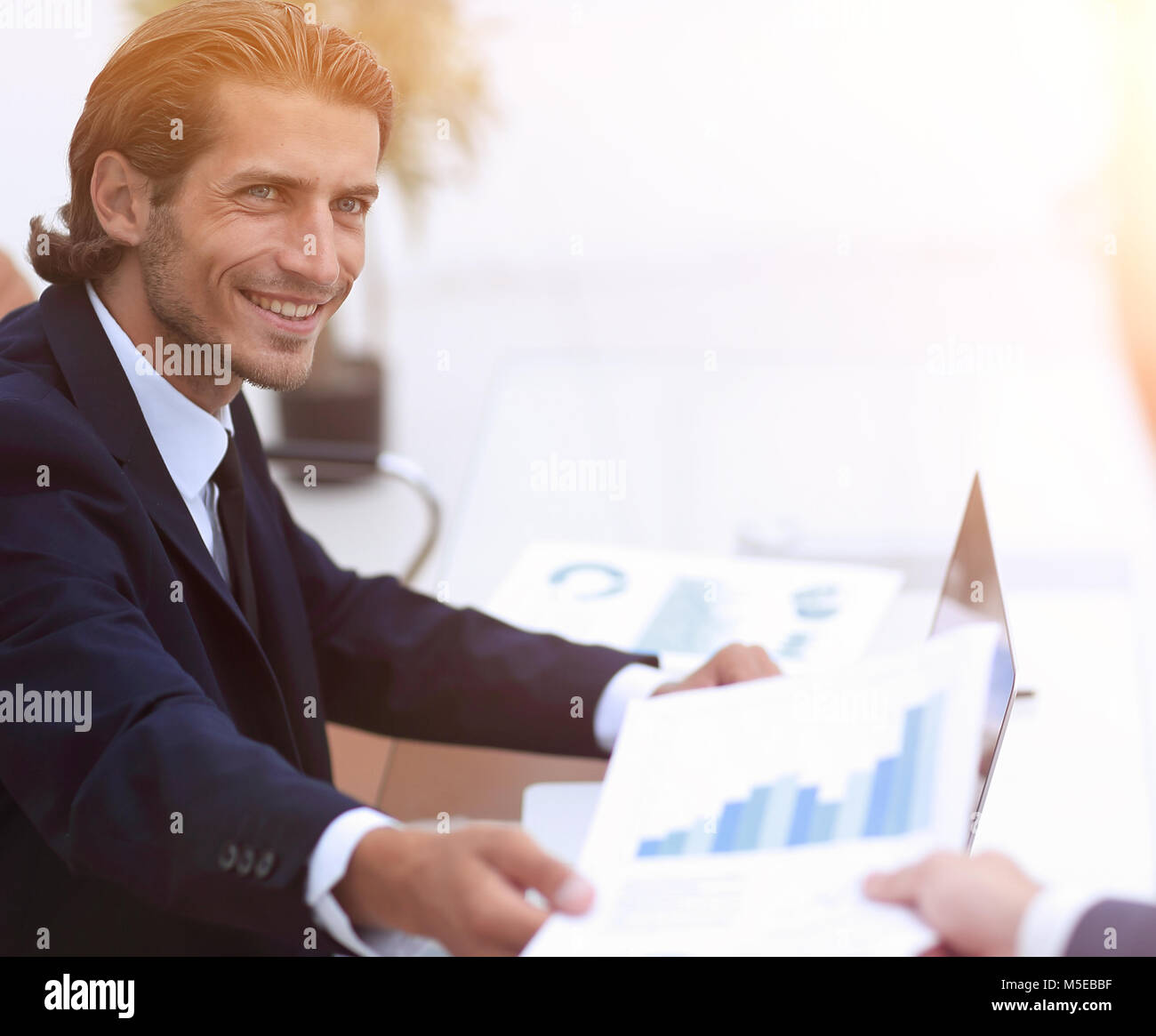 employee gives the Manager the financial report Stock Photo - Alamy