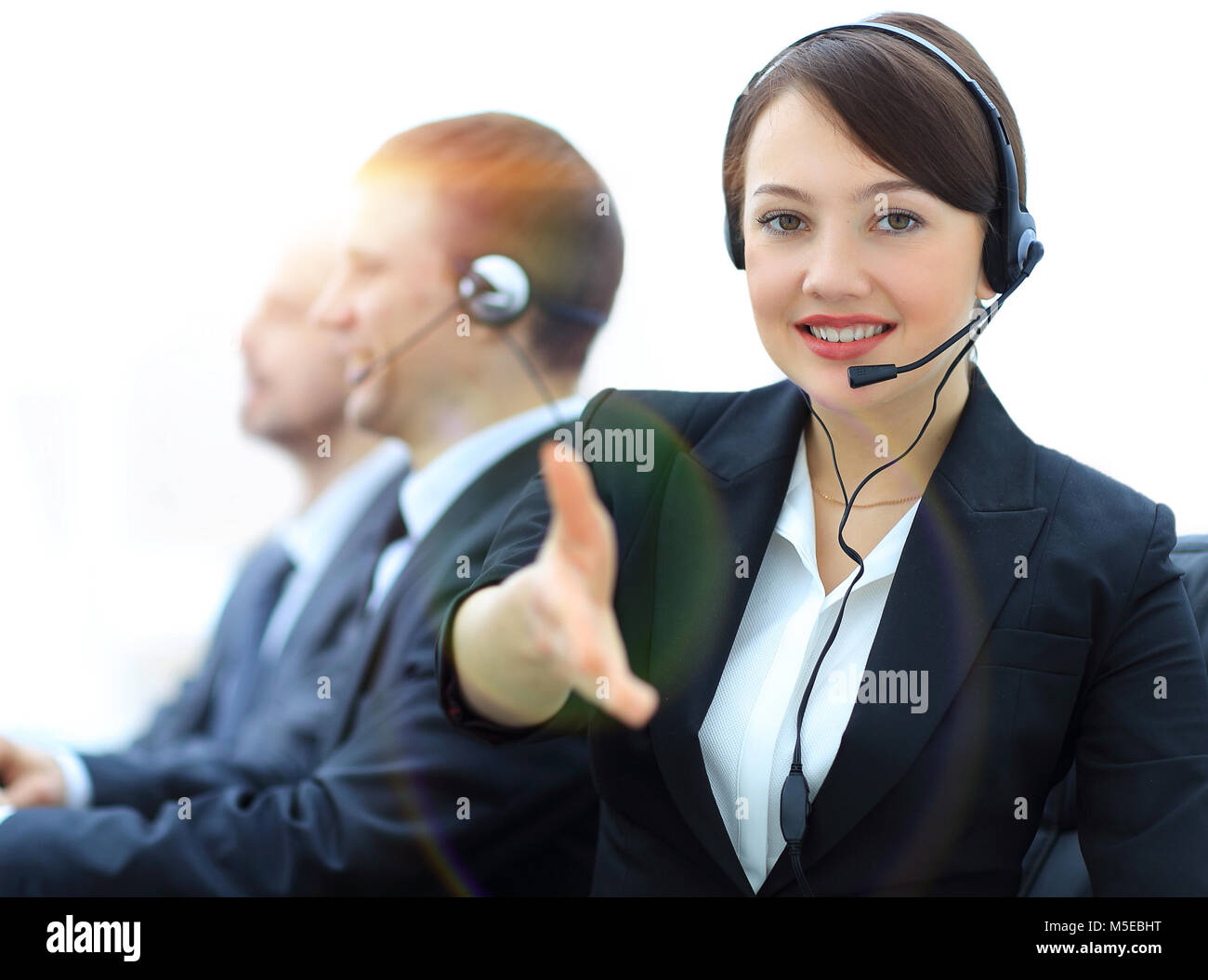 Manager of call center reaches out to shake hands Stock Photo - Alamy