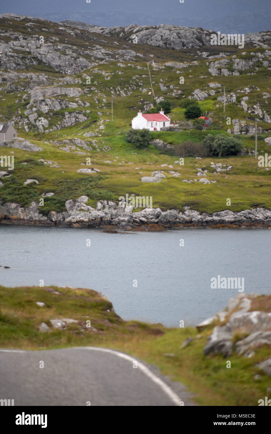 Outer Hebrides, Scotland. A sheltered farm house by a loch Stock Photo ...