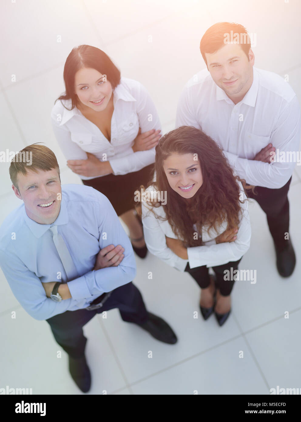 successful business team looking up Stock Photo - Alamy