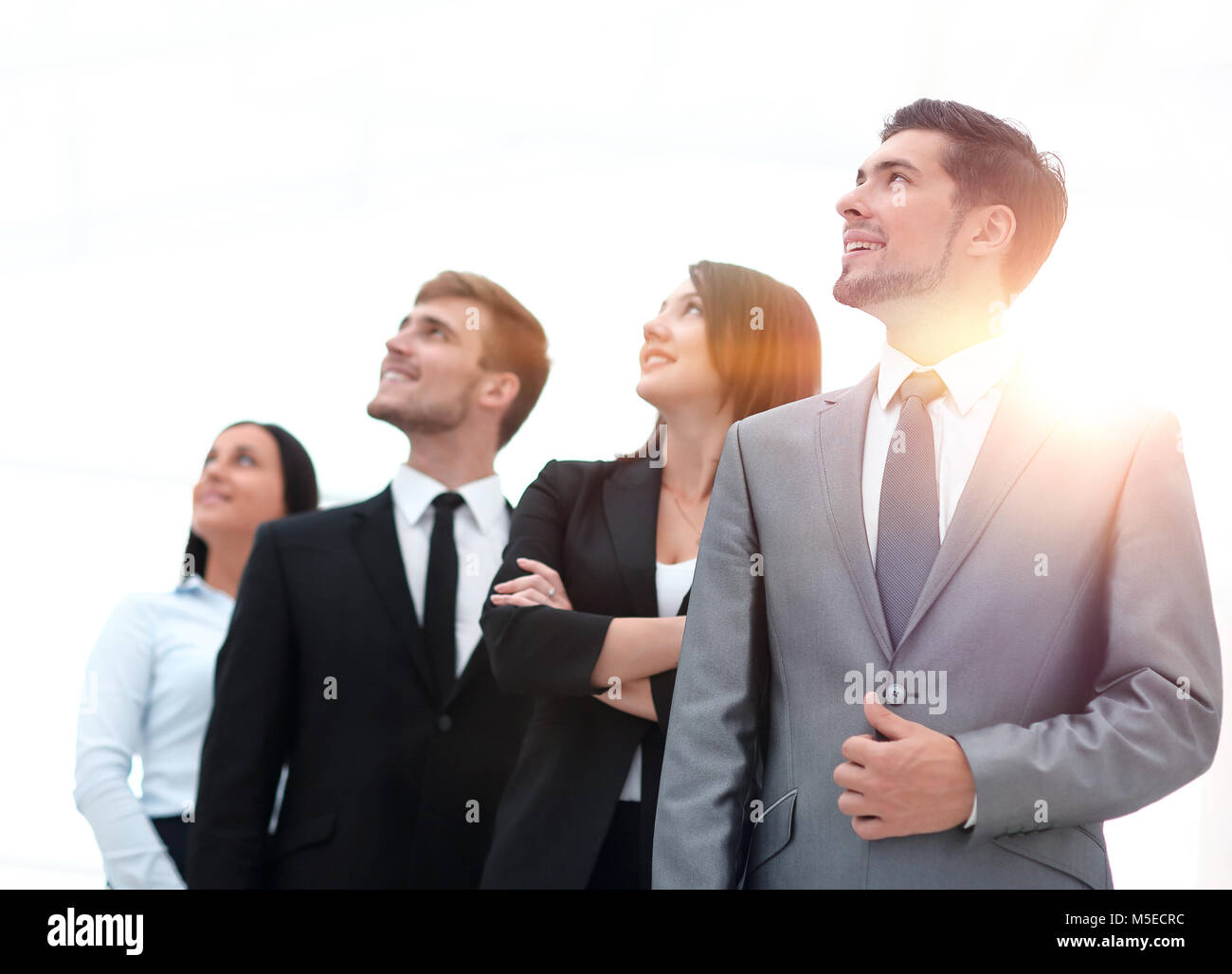 business team standing one behind the other and looking forward Stock ...