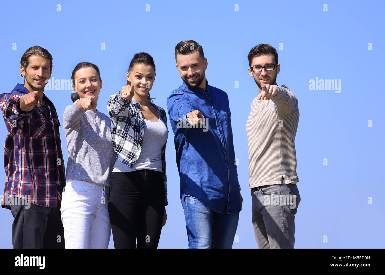 confident young people showing hands forward Stock Photo - Alamy