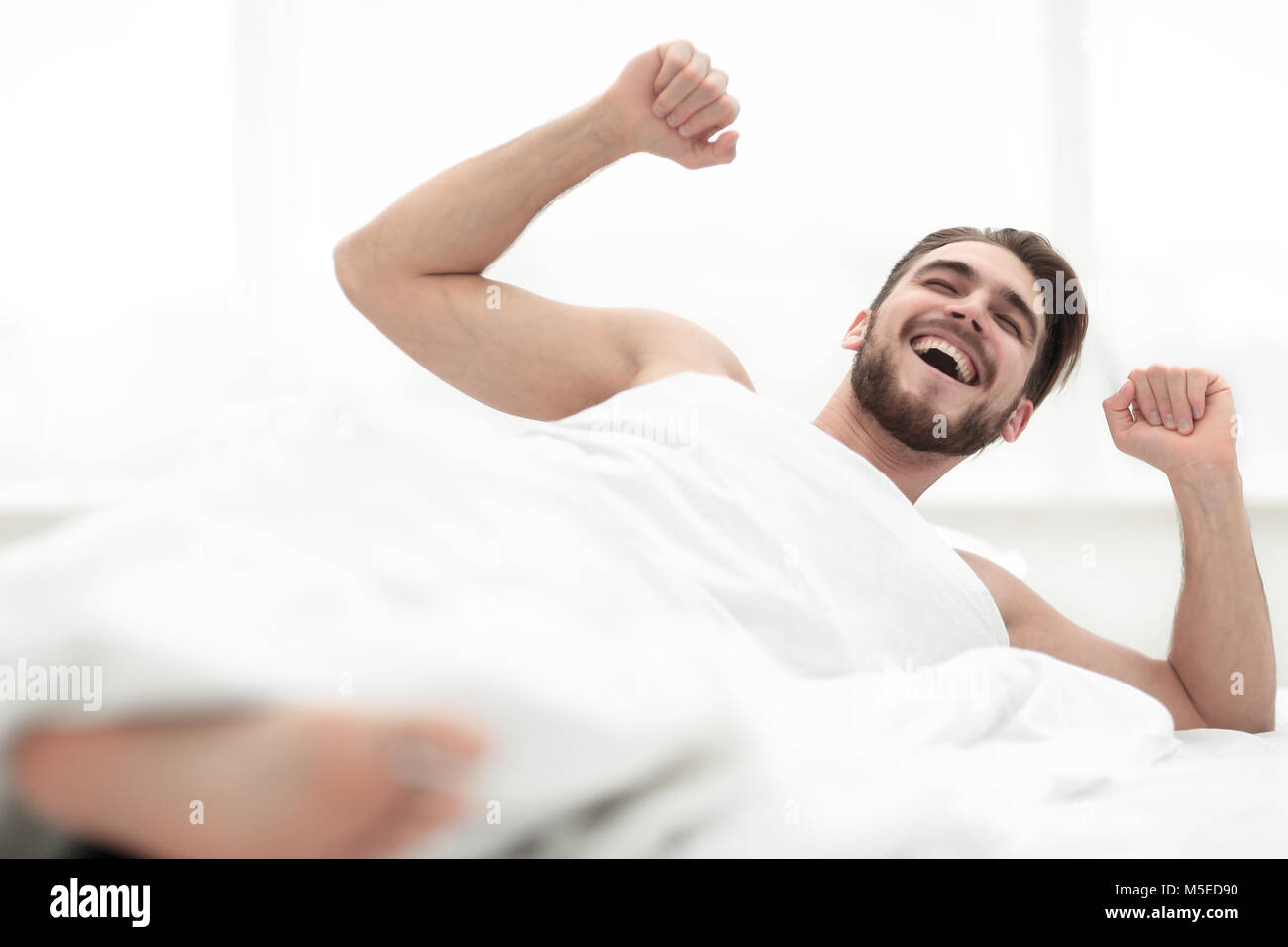 happy man waking up in the morning Stock Photo - Alamy