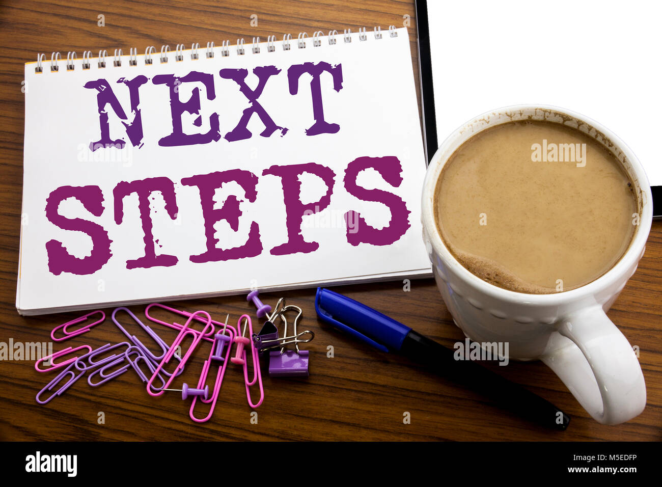 Hand writing text caption inspiration showing Next Steps. Business ...