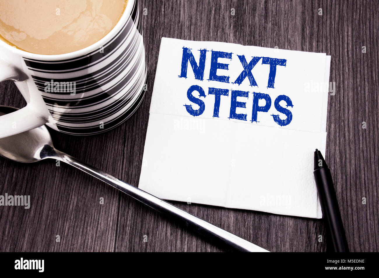 Handwritten text showing Next Steps. Business concept for Future Golas ...