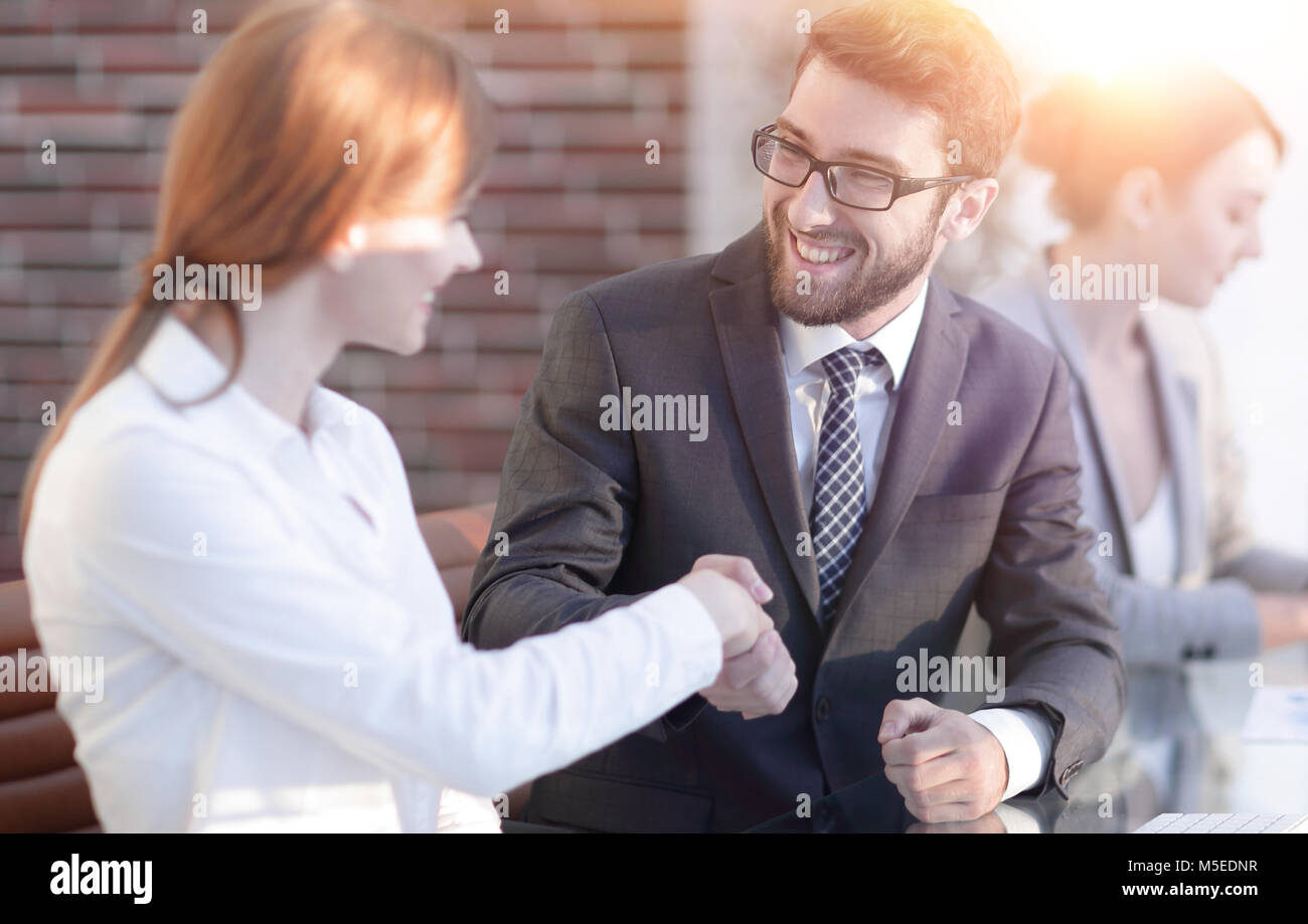 friendly handshake between colleagues in the office Stock Photo - Alamy