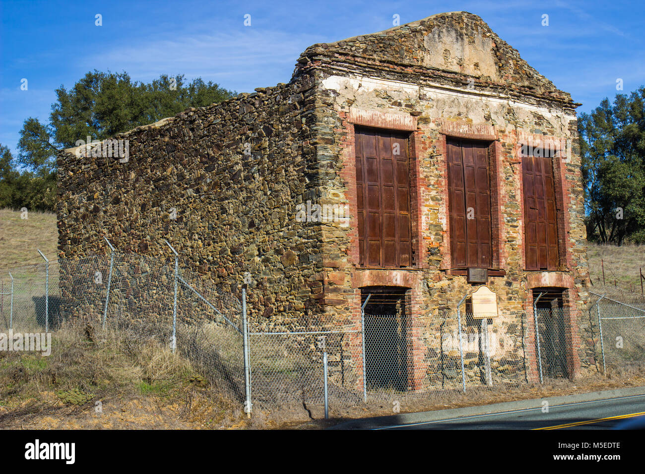 Historical Building With Three Iron Doors Stock Photo - Alamy