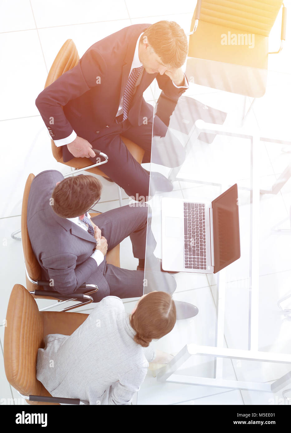 Businessman sitting around boardroom table hi-res stock photography and ...