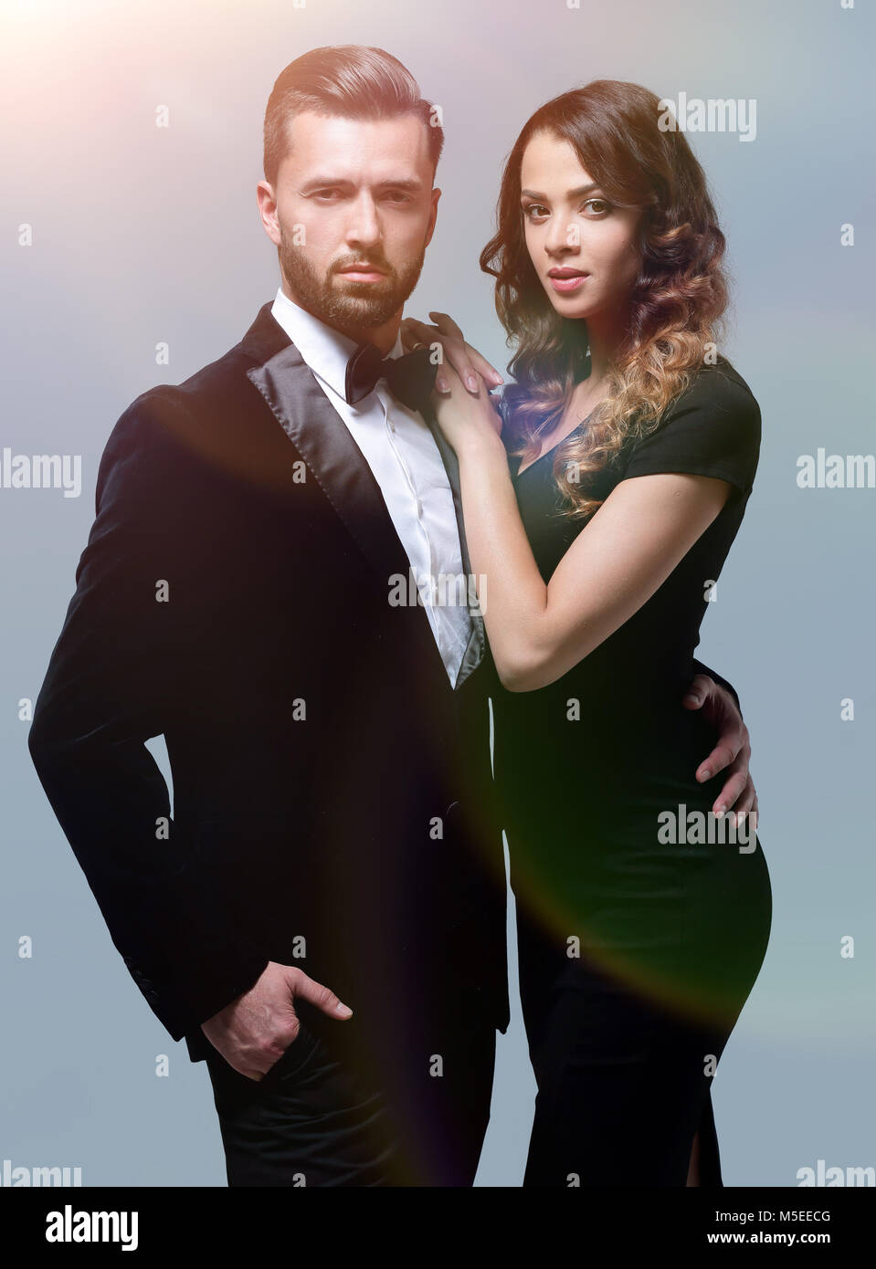 Business partners standing on a gray background Stock Photo - Alamy