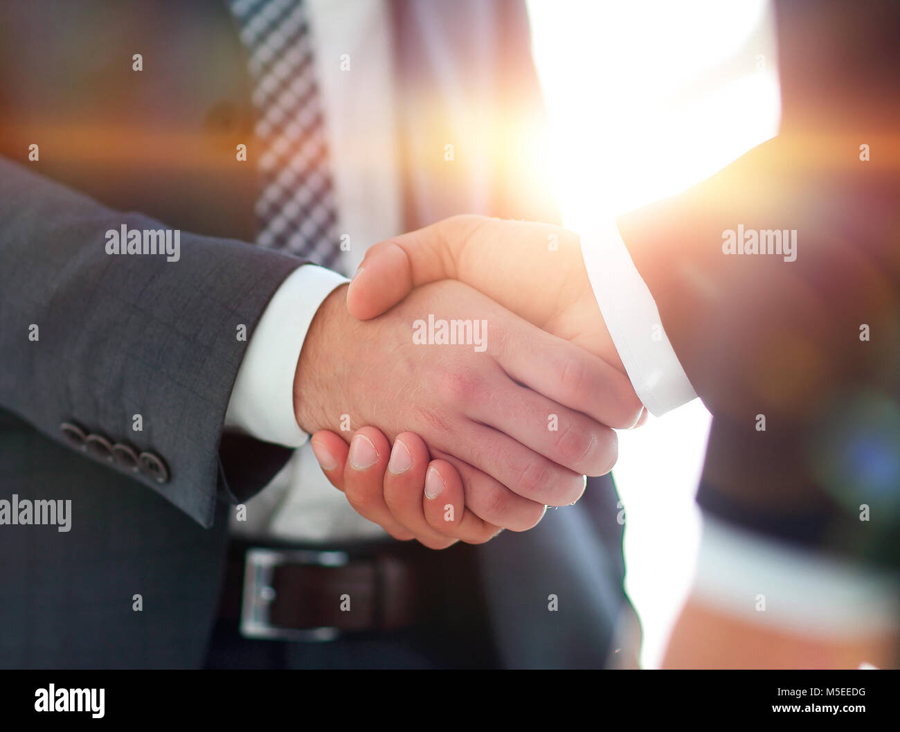 Businessman giving his hand for handshake to partner Stock Photo - Alamy