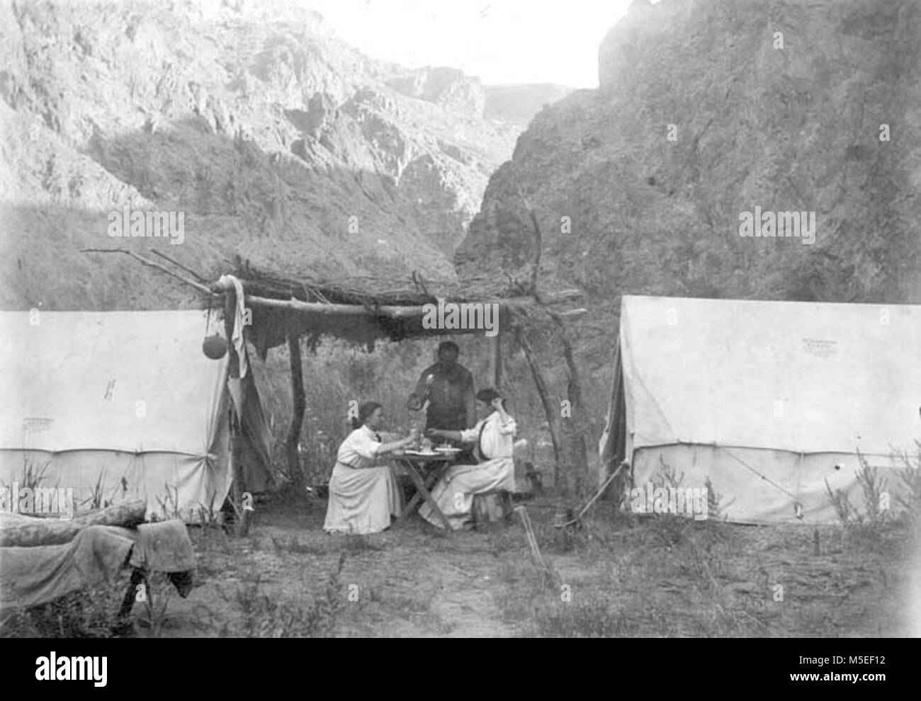 Grand Canyon Historic- Rust Camp Guests VIEW NORTH. MAN SERVING A MEAL ...