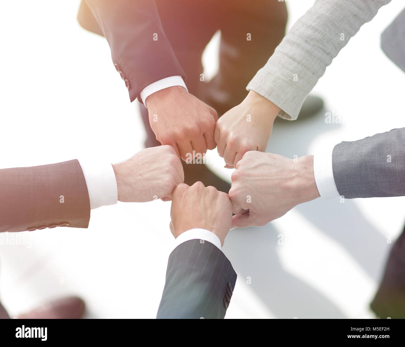 young people putting hands together Stock Photo - Alamy