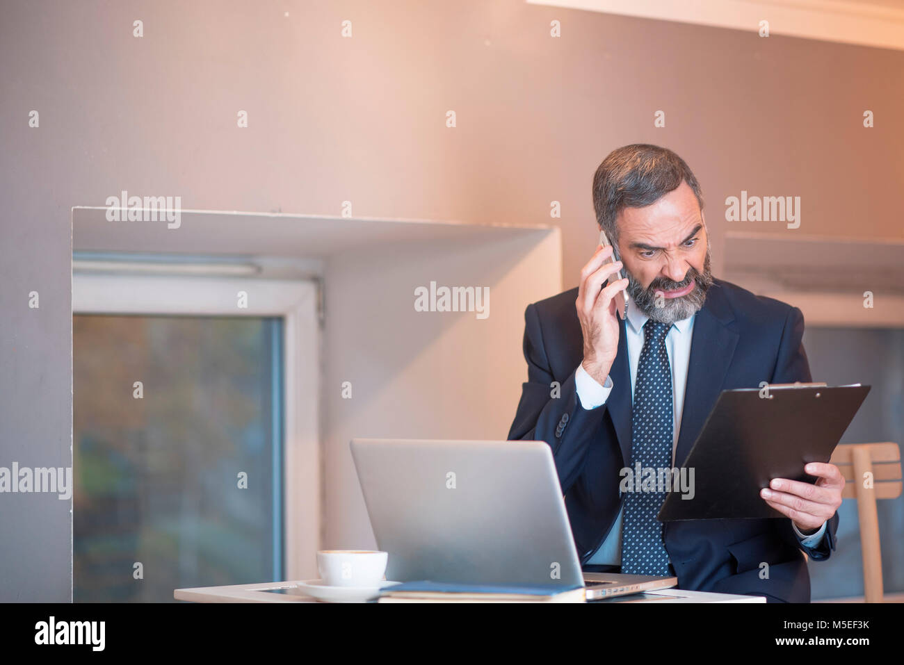 Angry business man yelling at his employee for a mistake made on ...