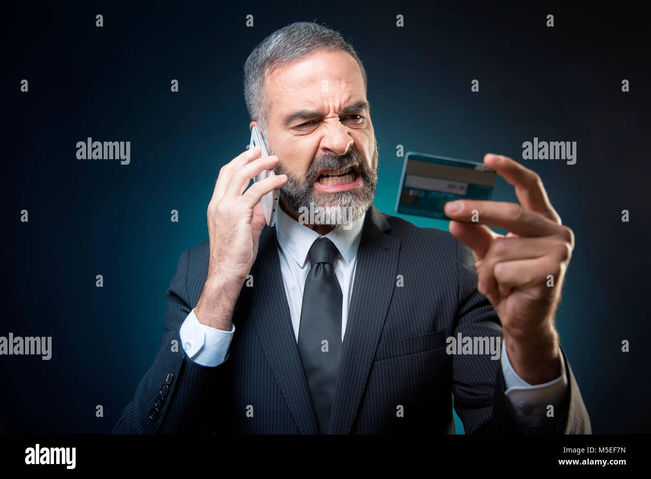 Furious and enraged senior business man fighting with bank clerk over ...