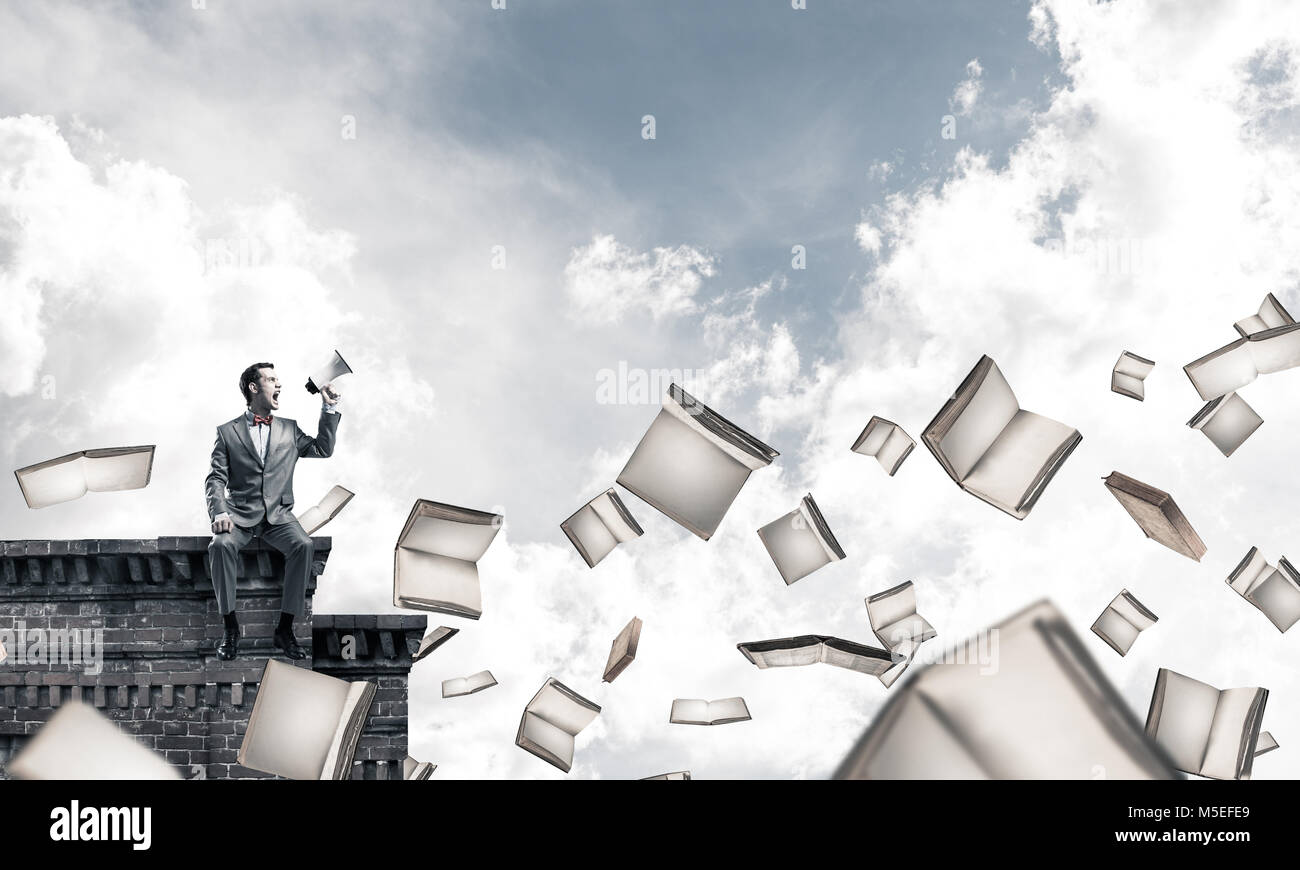 Holding on to edge of building hi-res stock photography and images - Alamy