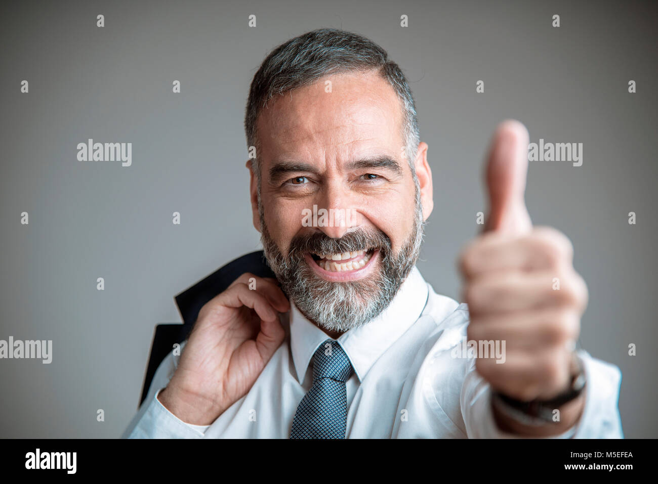 Senior business man approving, giving a thumb up, giving you full ...