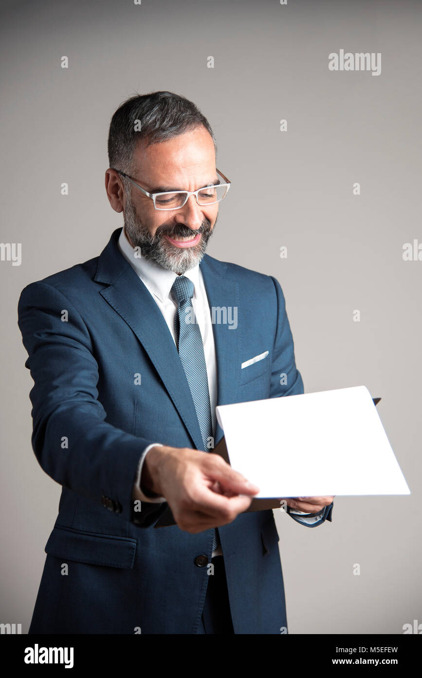 Senior business man revising the numbers, everything's in perfect order ...