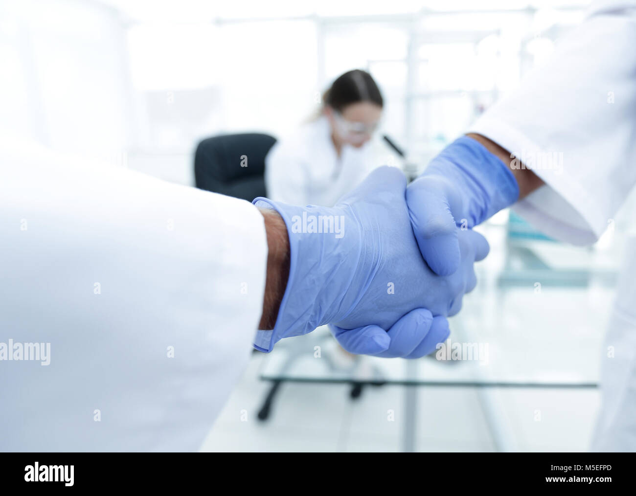 hand in the medical glove (handshake Stock Photo - Alamy
