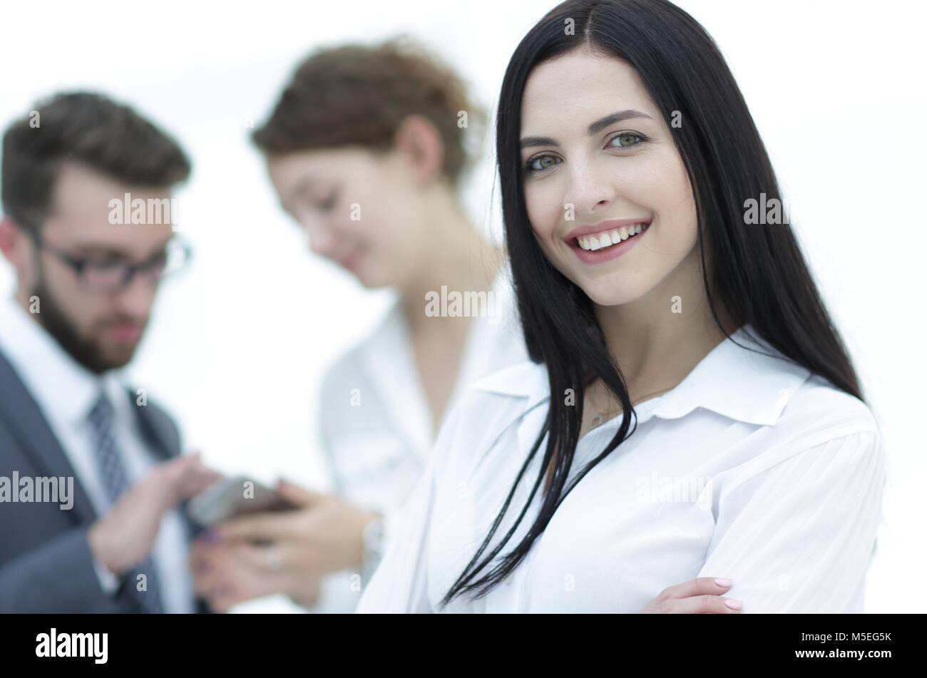 close-up of a beautiful woman manager and co-workers in the office ...