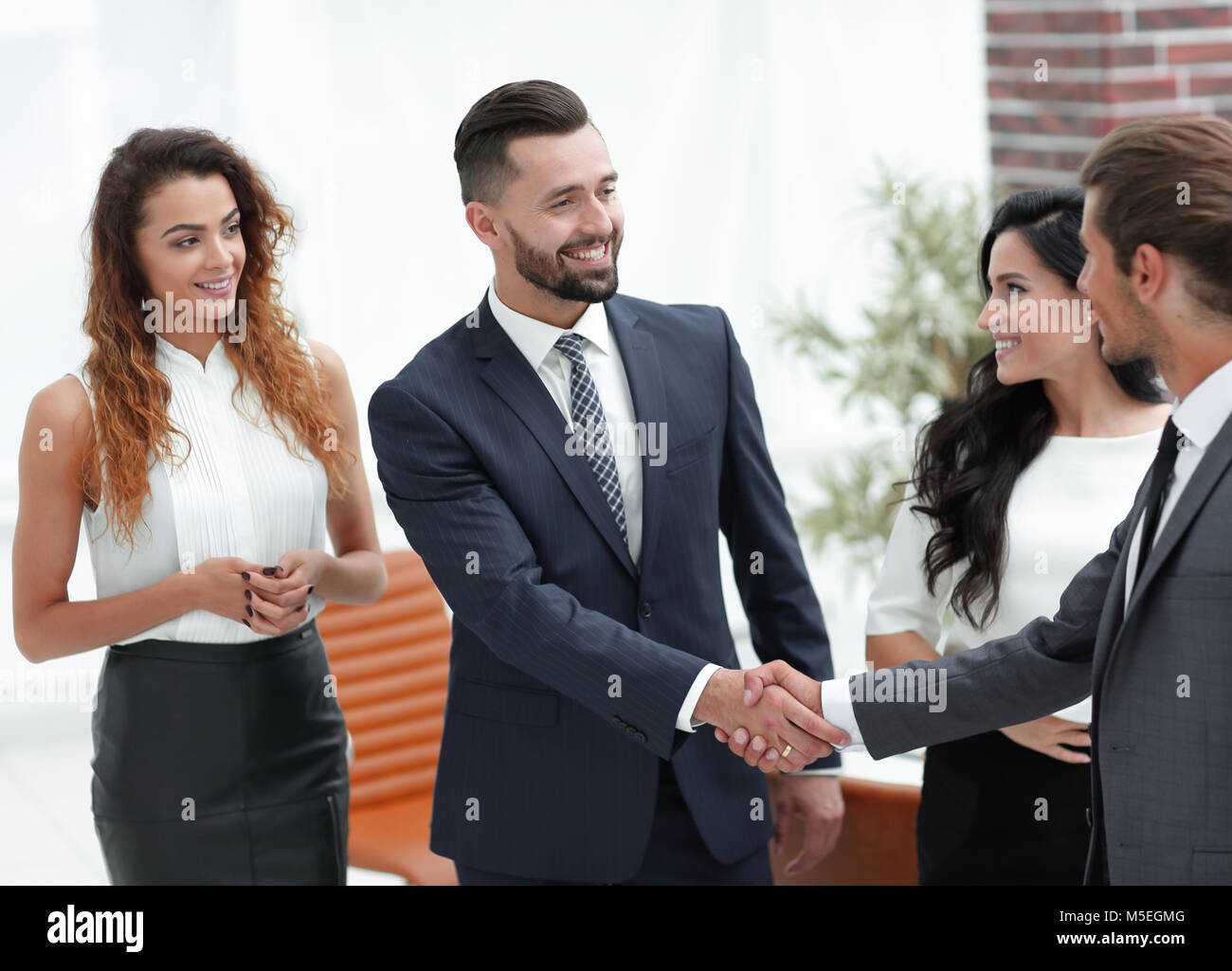 handshake business partners in the office Stock Photo - Alamy