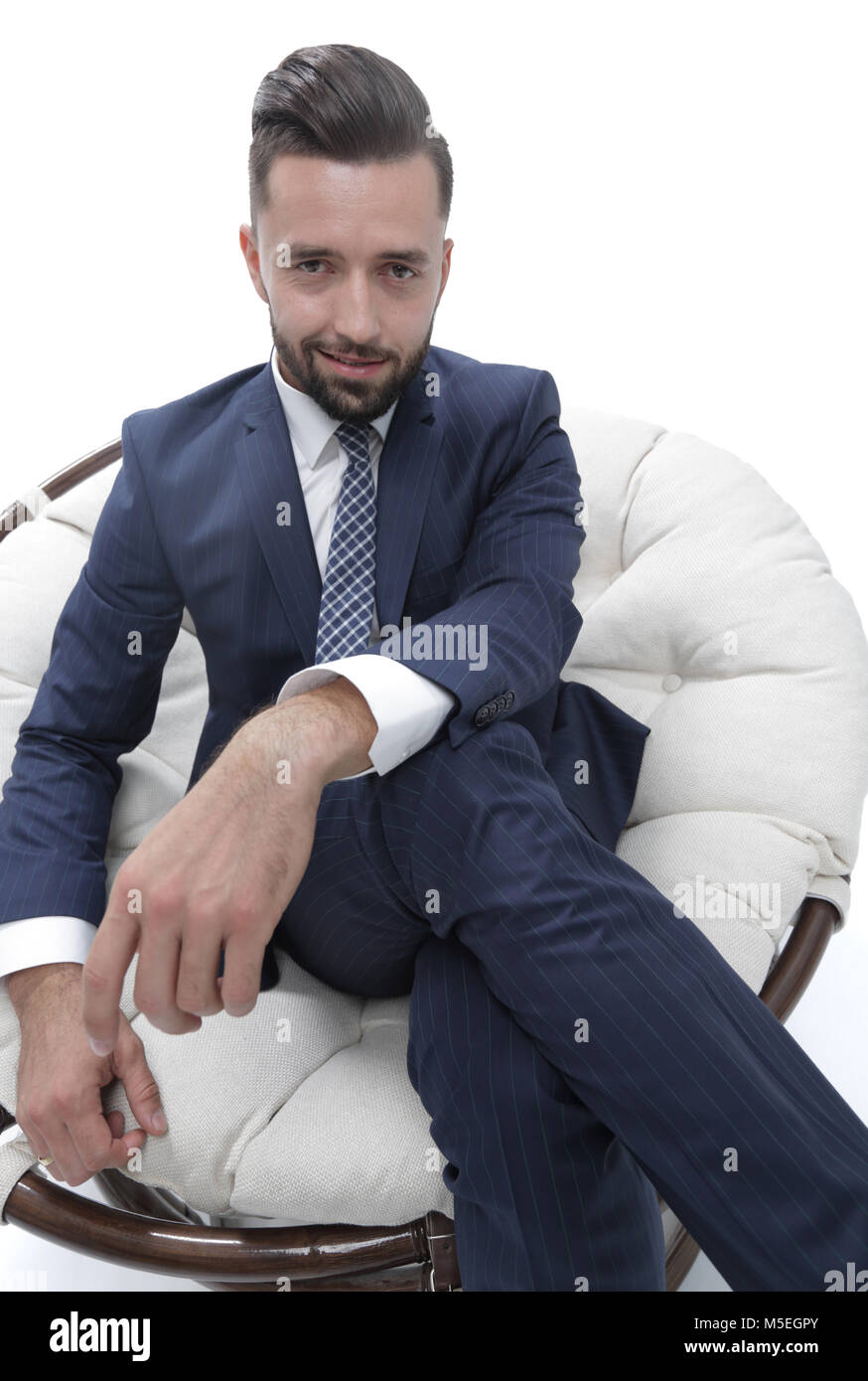 confident businessman sitting in a chair Stock Photo - Alamy