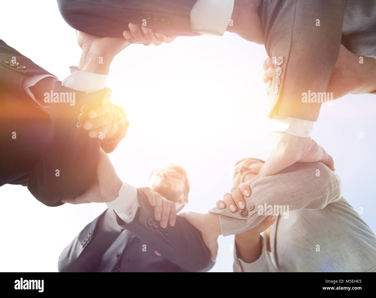 business team are taking each other's hands Stock Photo - Alamy