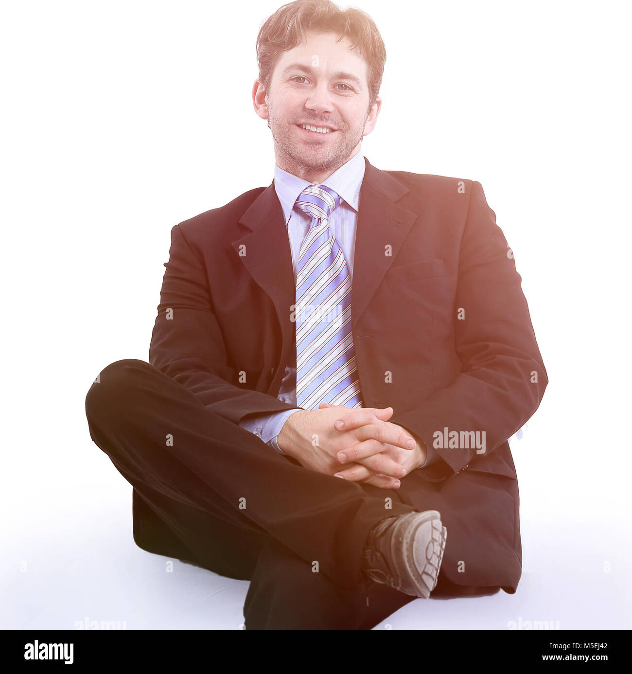 confident businessman sitting on chair Stock Photo - Alamy