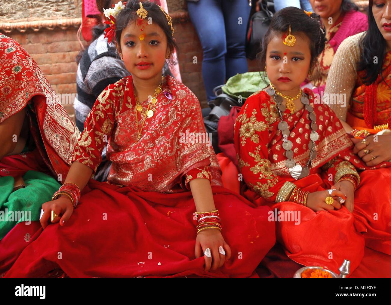 Kathmandu, Nepal. 23rd Feb, 2018. Girls from Newar community attend a ...