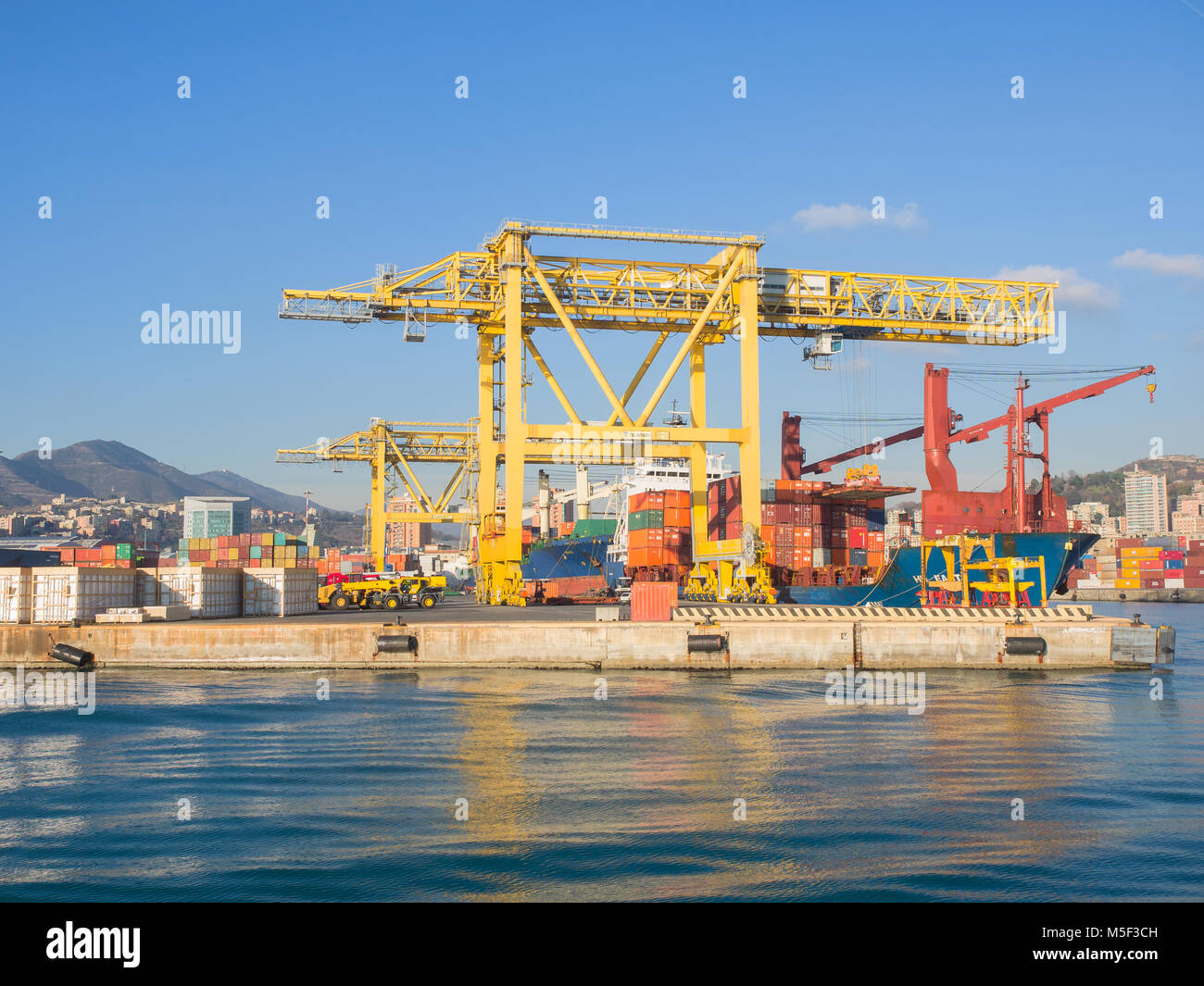Loading and unloading cargo into and from ships hi-res stock ...