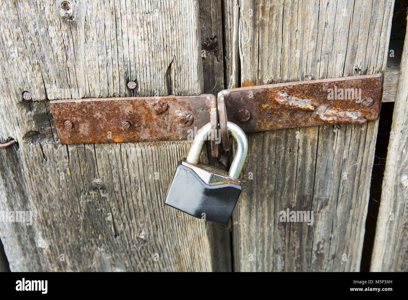 old lock on wood door Stock Photo - Alamy