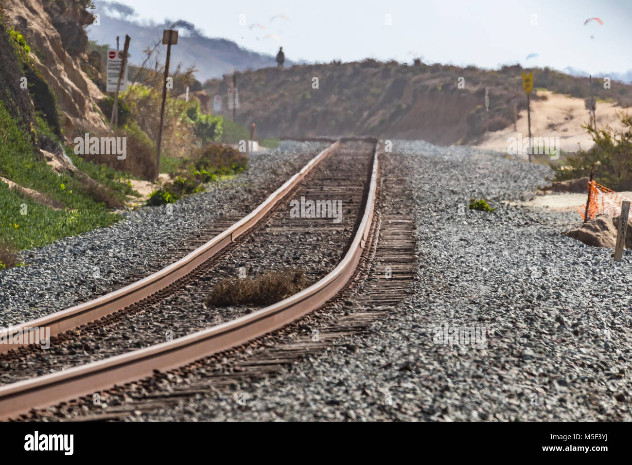 railroad train tracks on curve Stock Photo - Alamy