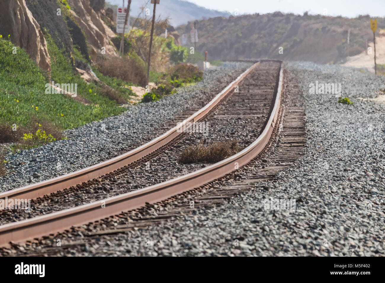 railroad train tracks on curve Stock Photo - Alamy
