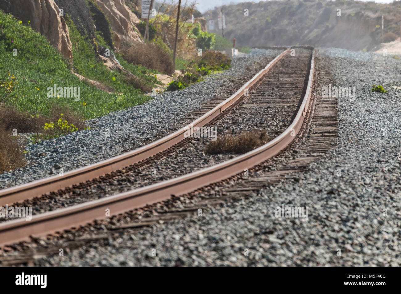 railroad train tracks on curve Stock Photo - Alamy